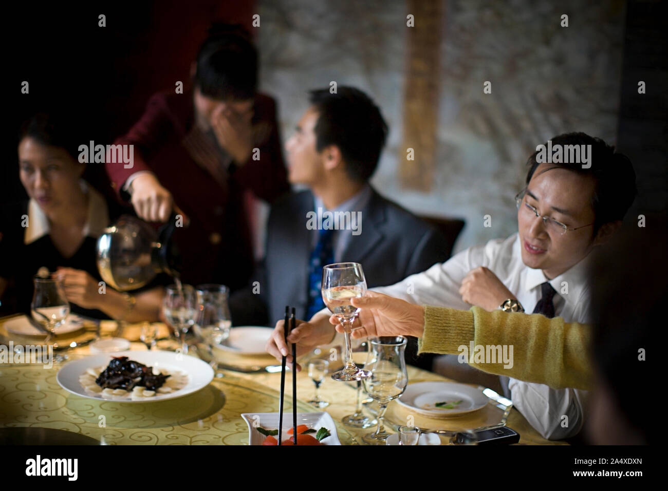 Business colleagues enjoying a lunch inside a restaurant Stock Photo ...