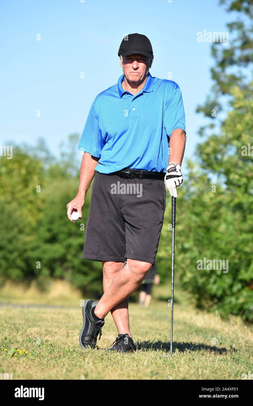 Older Male Golfer Resting With Golf Club Playing Golf Stock Photo - Alamy