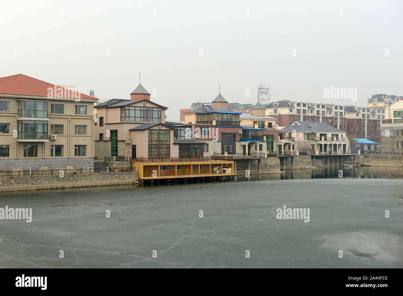 New, modern villas by a frozen lake, Hunchun, Jilin province, northeast ...