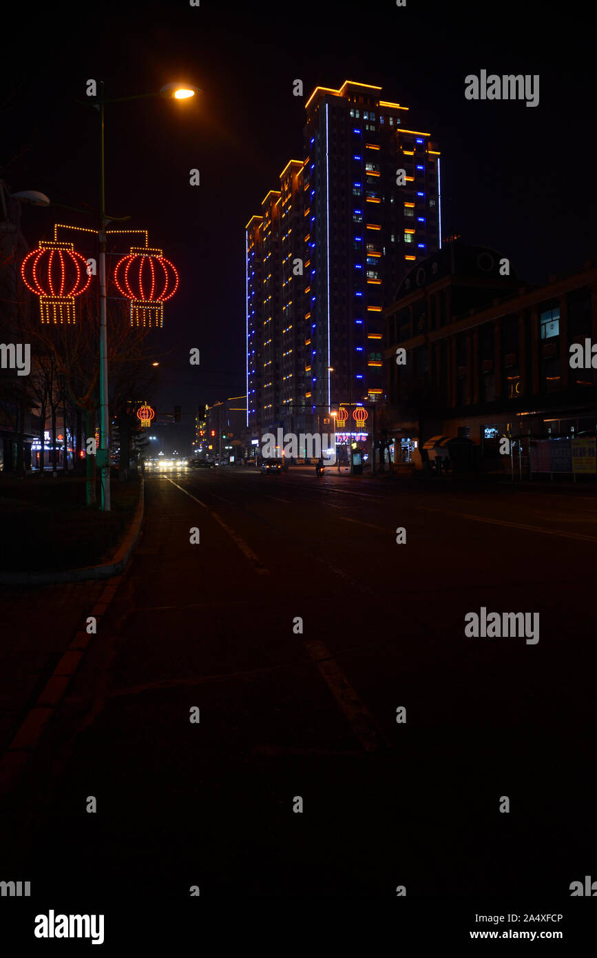 Night streets scene in the city of Hunchun,near the North Korea border ...