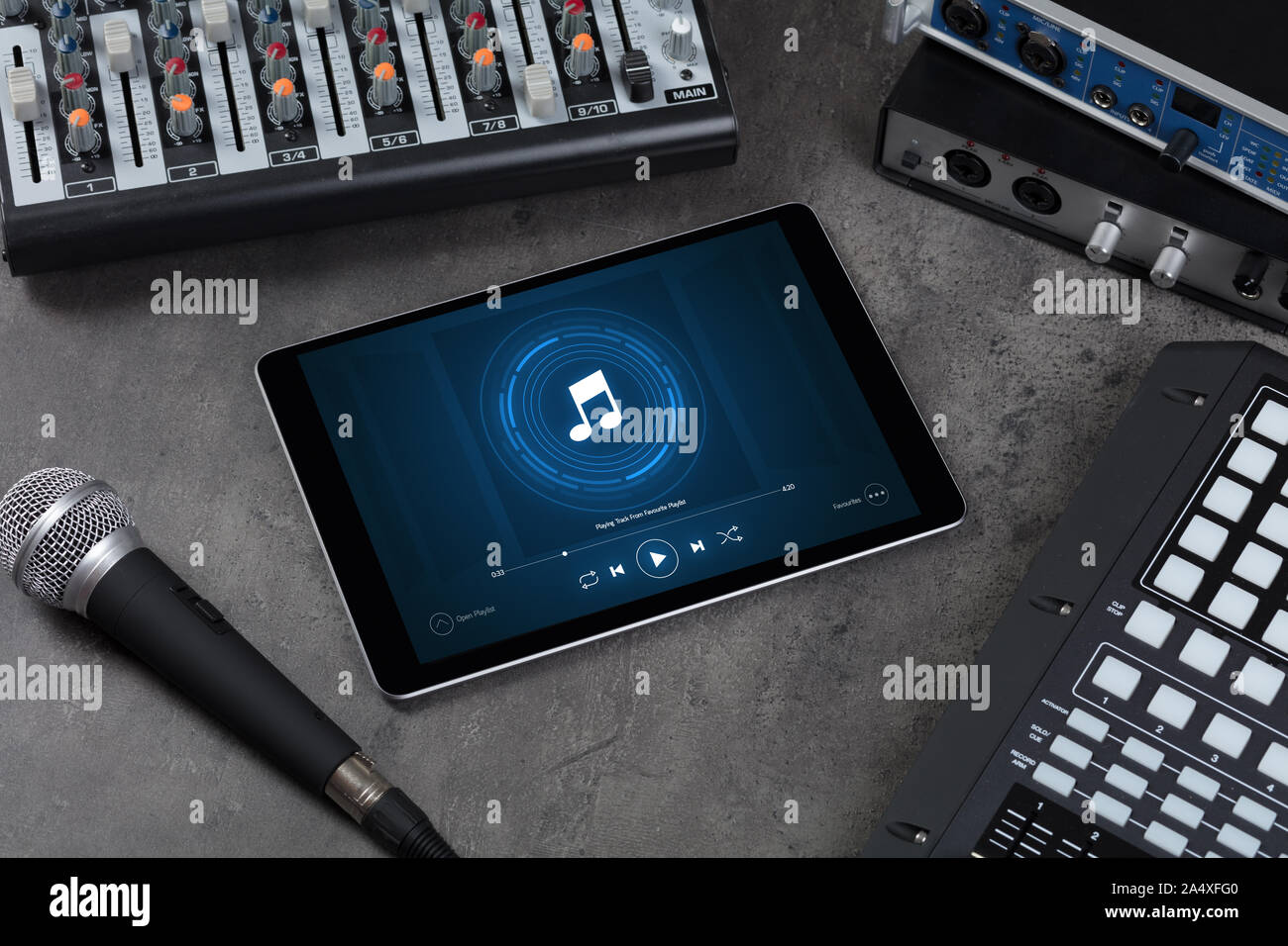 Playing song on tablet with electronic music instruments around Stock ...