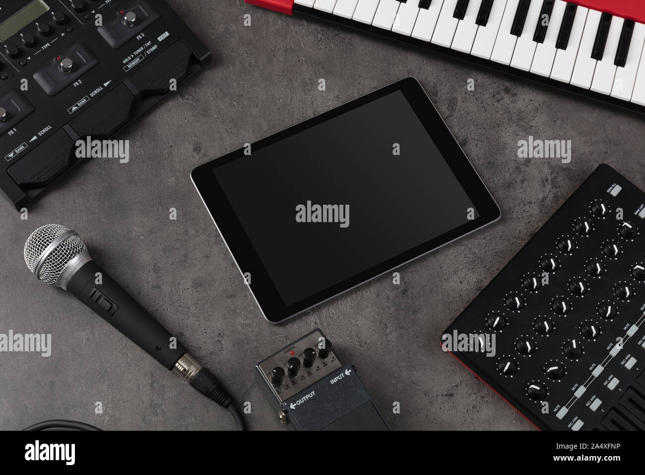Empty tablet and electronic music instruments Stock Photo - Alamy