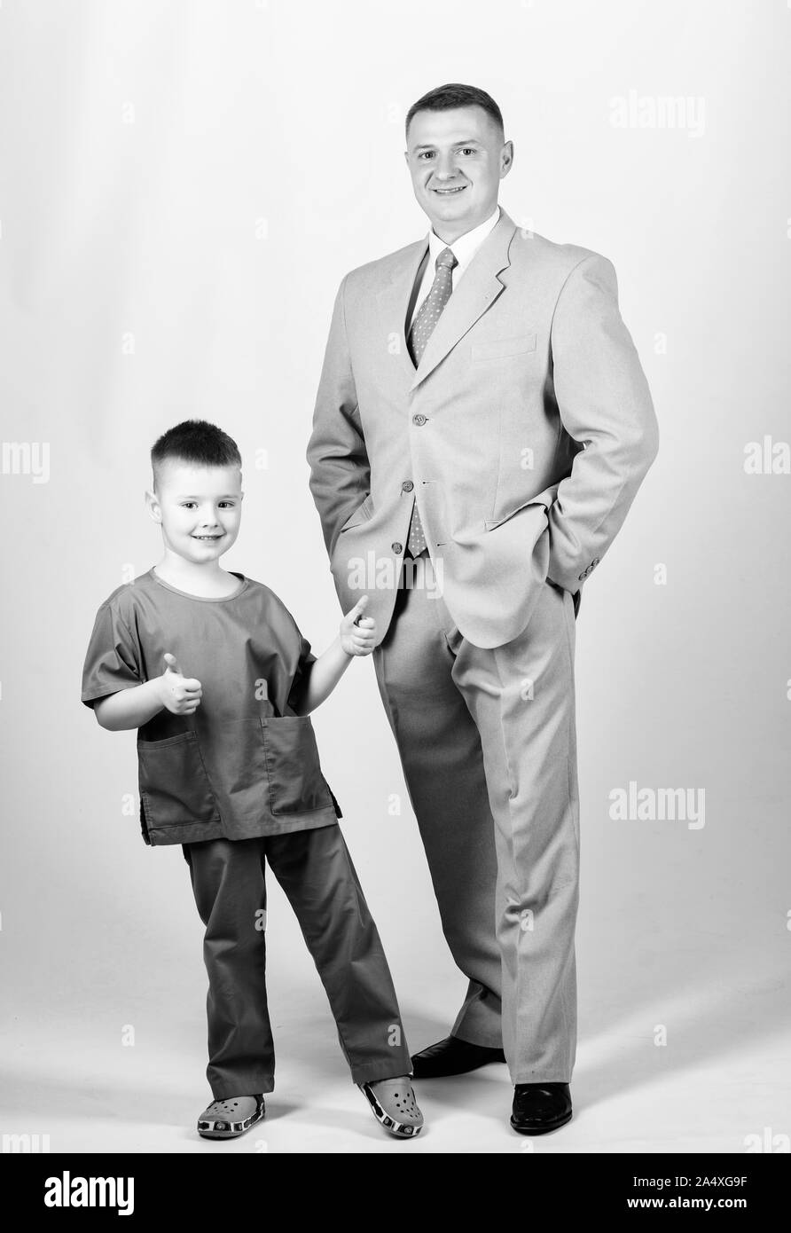 Doctor respectable career. Dad boss. Father and cute small son. Child ...
