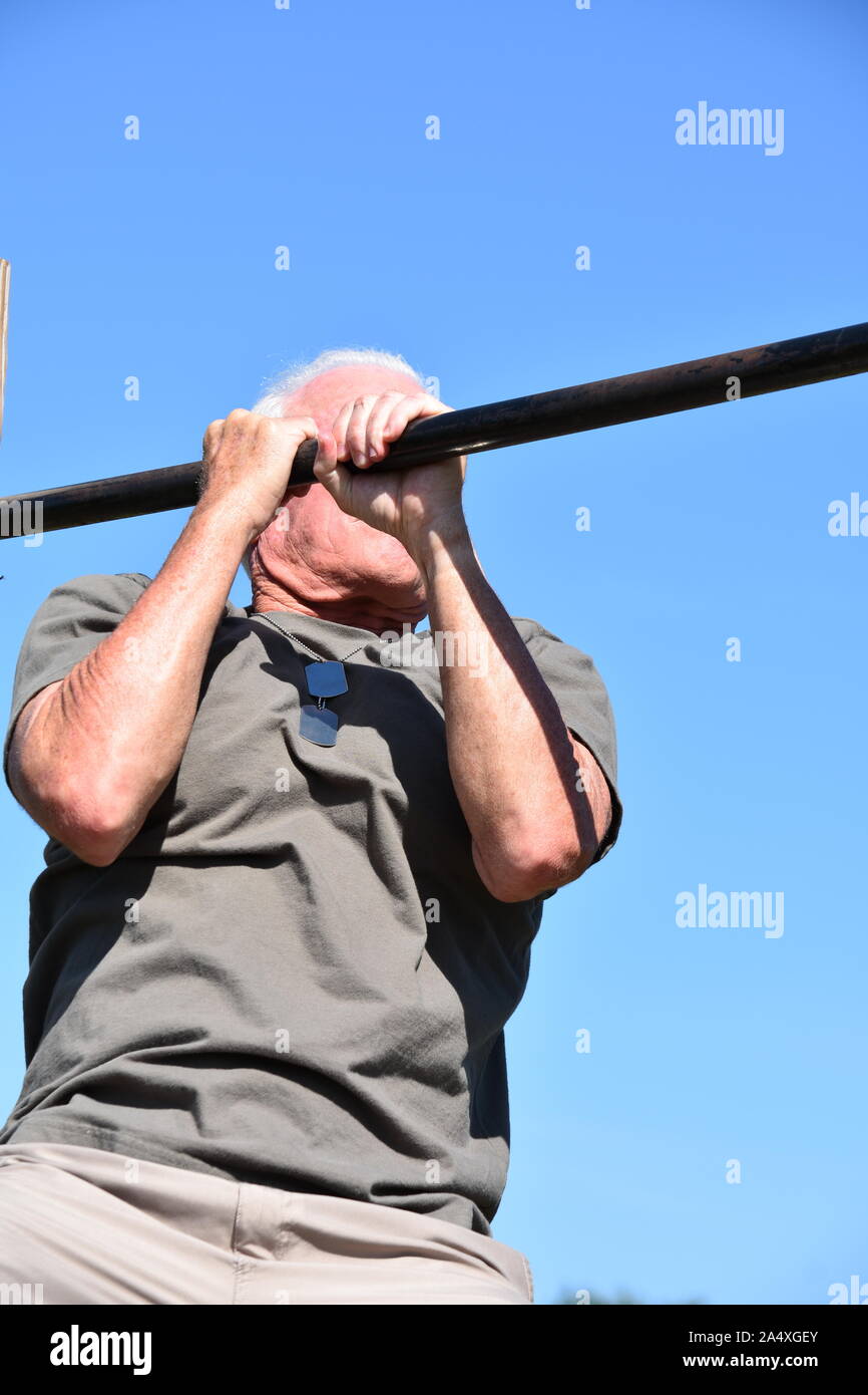 Military Senior Male Veteran And Muscles Exercising Stock Photo - Alamy