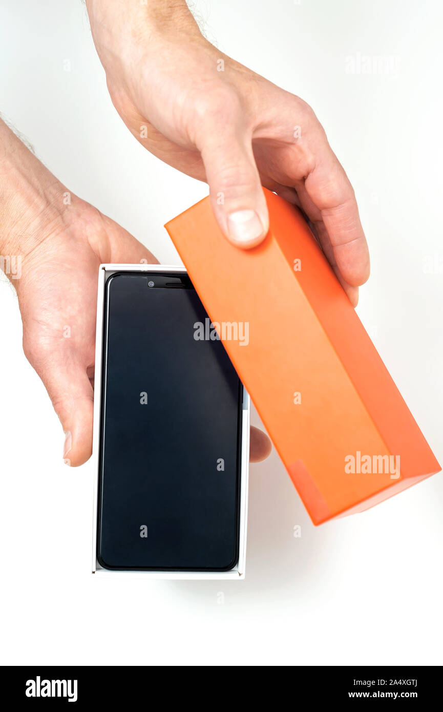 Hands holding black smartphone bright hi-res stock photography and ...