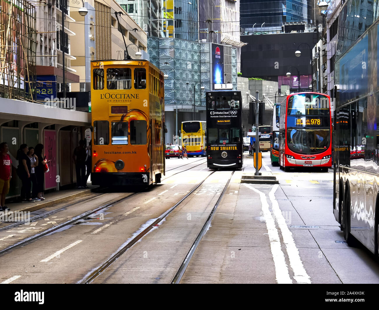 HONG KONG, CHINA- OCTOBER, 2, 2017: two trams approach the camera at ...