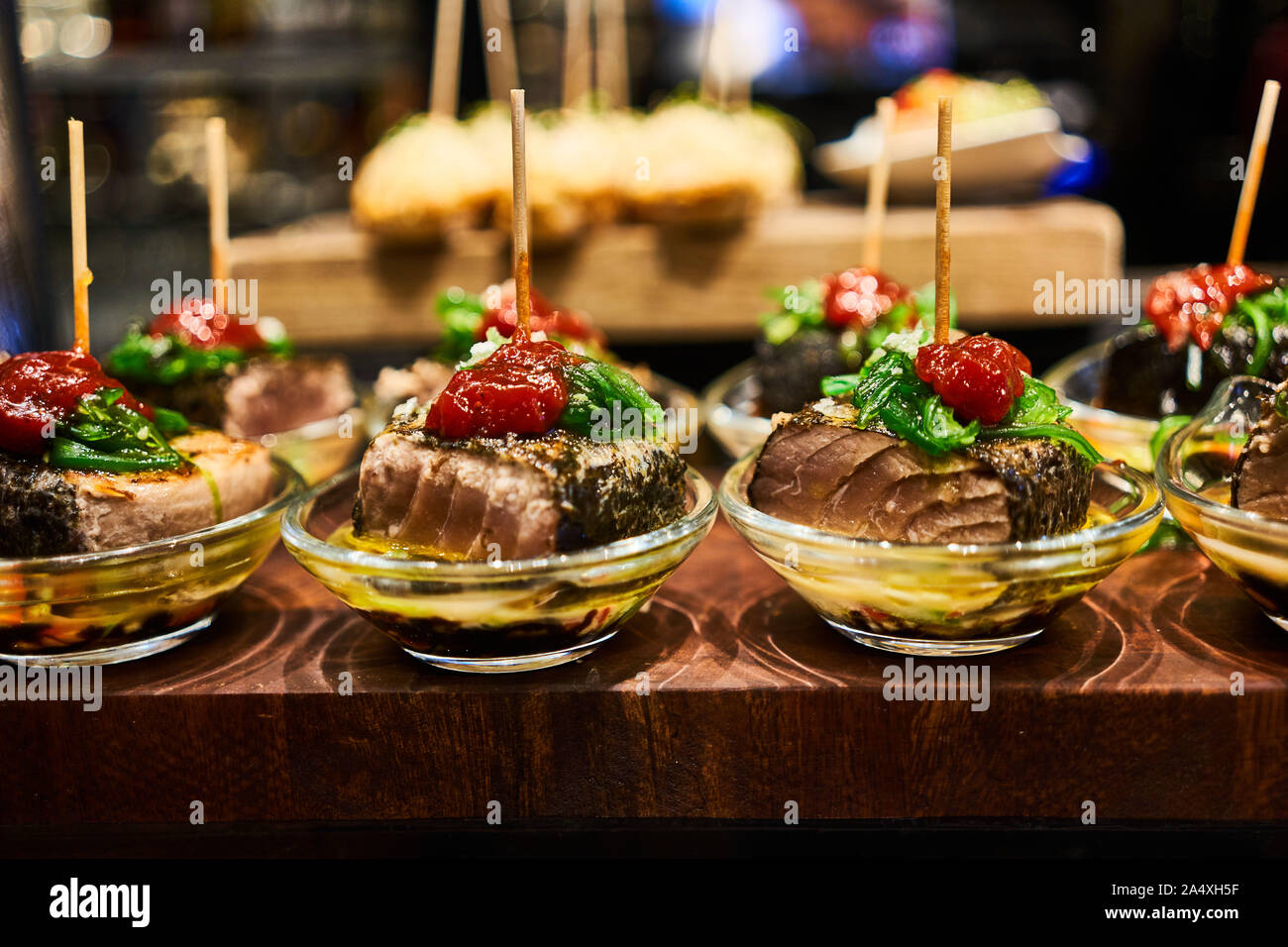 Elaborate pinchos line the bar of restaurant Víctor Montes jatetxea in ...