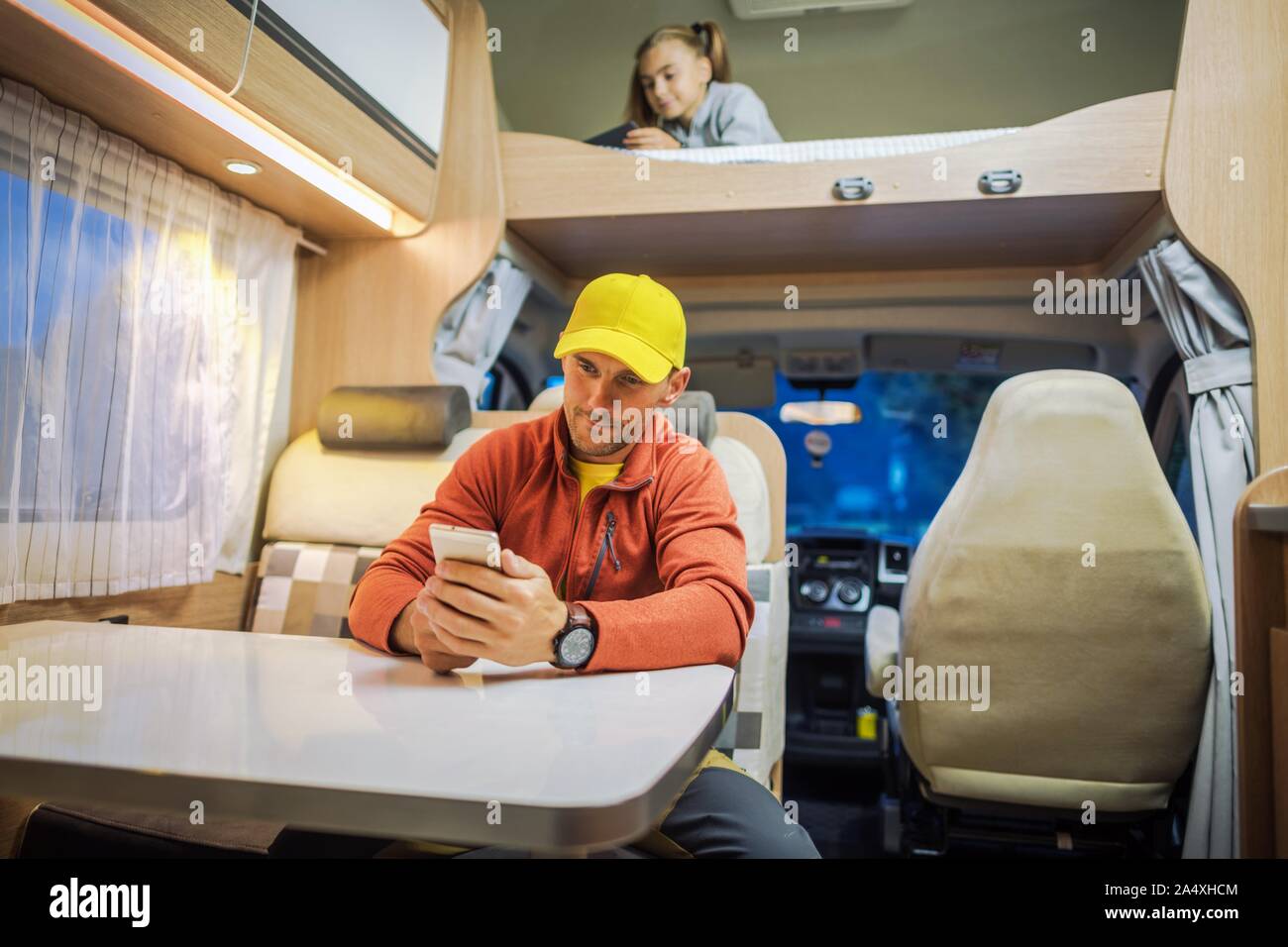 Family Spending Time Inside Camper Van RV Motorhome with Their ...