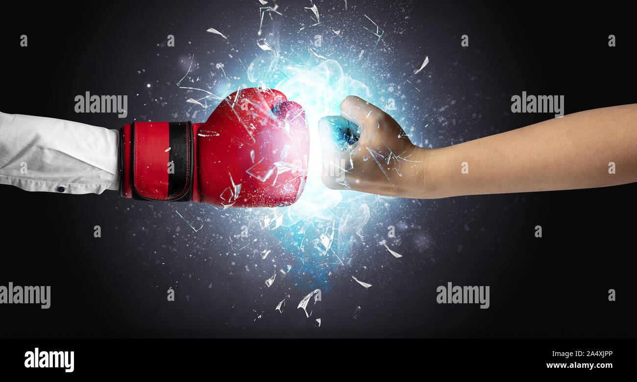 Two hands fighting and breaking glass into small pieces with blue light ...