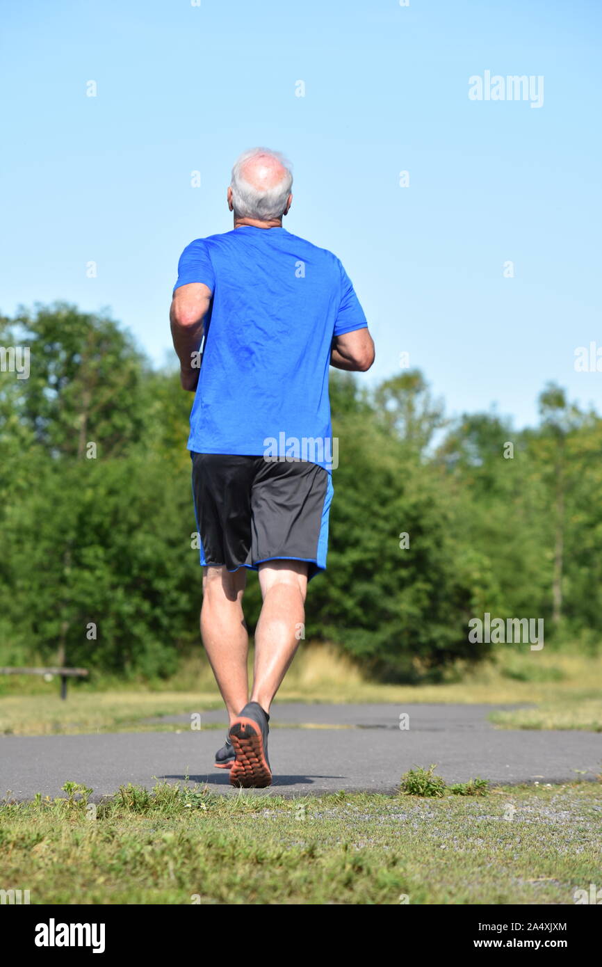 Bald man running hi-res stock photography and images - Alamy