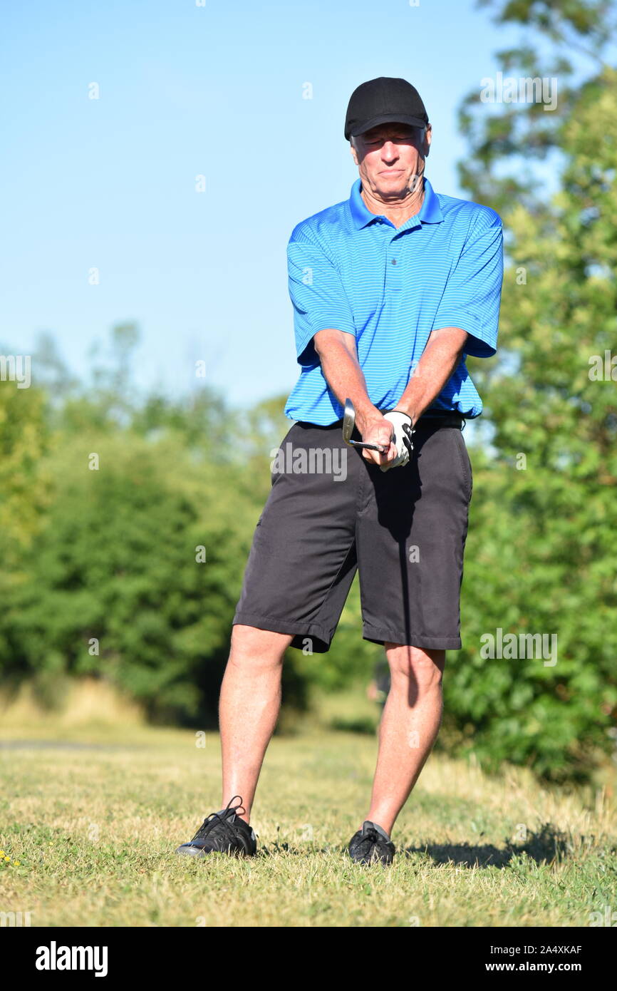 Fit Adult Male Athlete Posing With Golf Club Stock Photo - Alamy