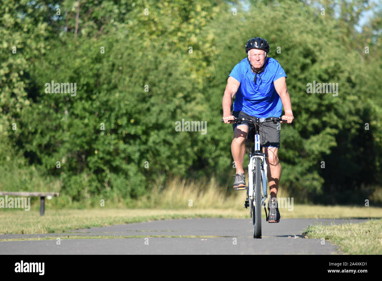 Serious Male Cyclist Riding Bike Stock Photo - Alamy