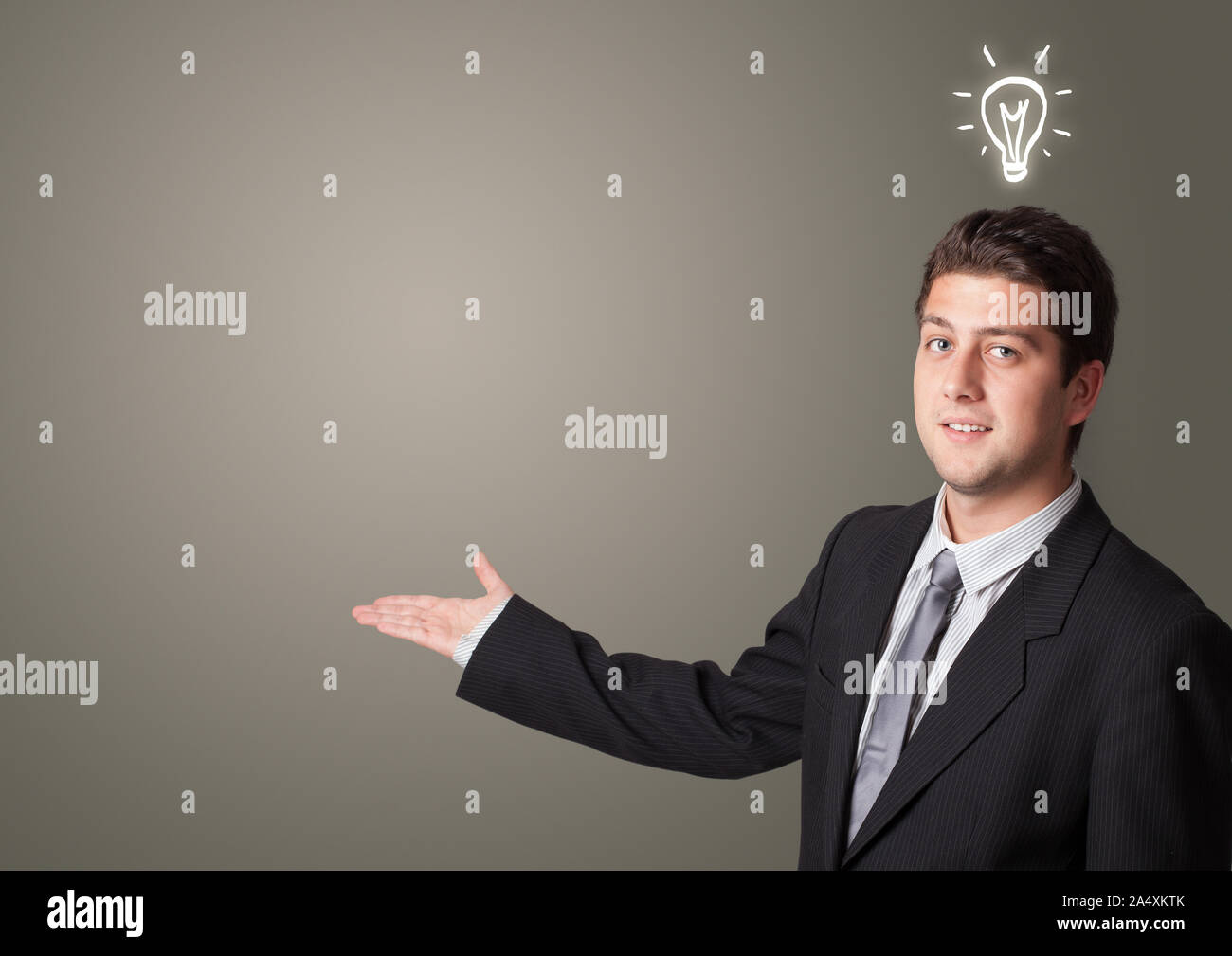 Young smiling person presenting new idea concept Stock Photo - Alamy