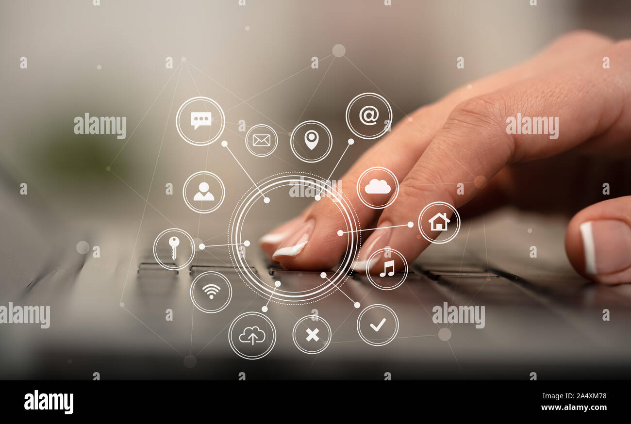 Business woman hand typing on keyboard with application icons around ...