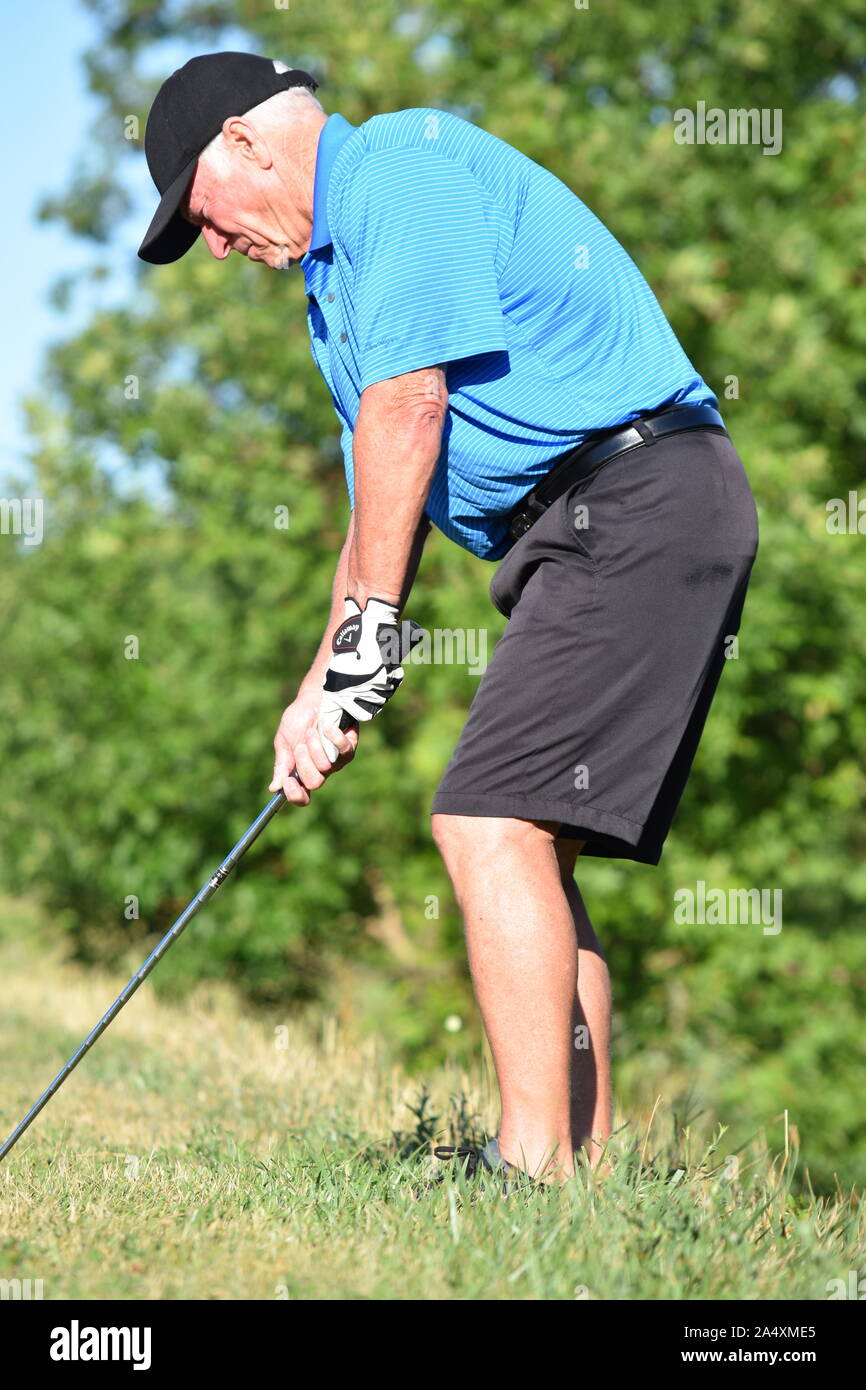 Adult Male Athlete Working Out With Golf Club Swinging Stock Photo - Alamy