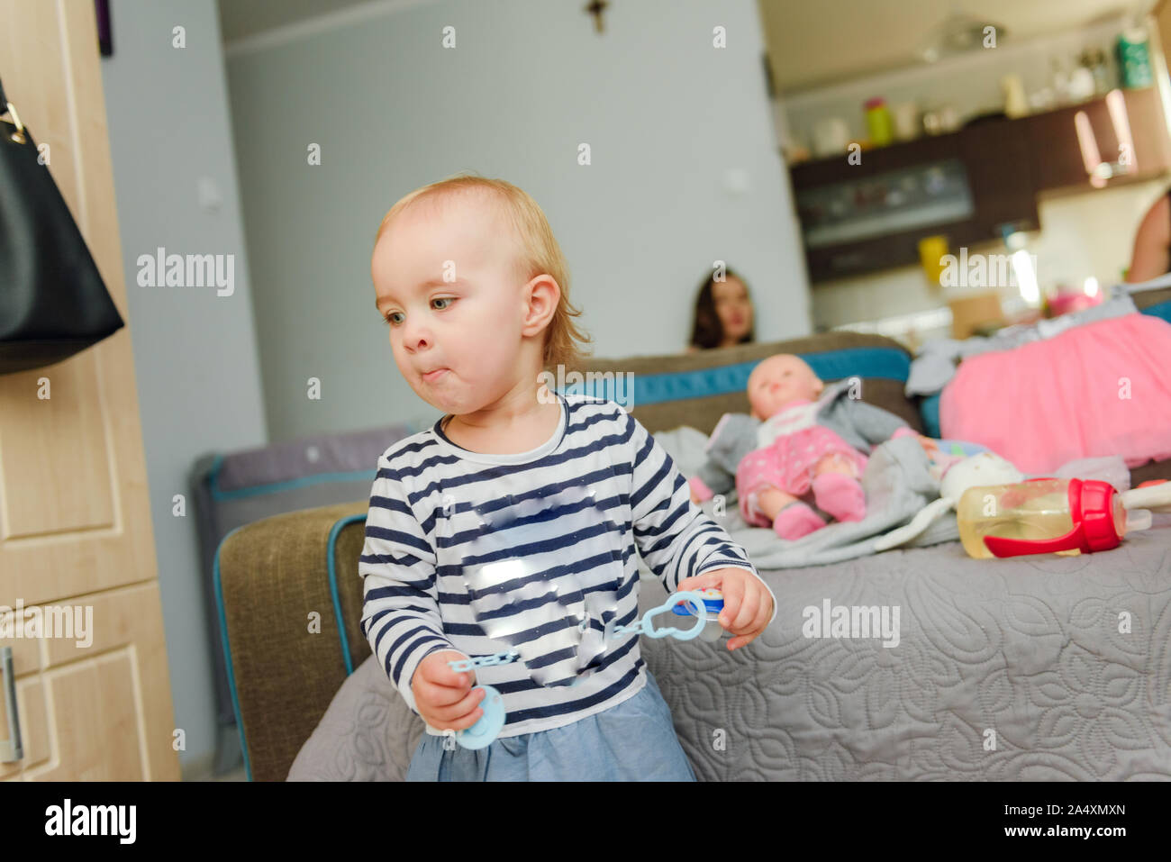 Portrait of adorable baby girl. Childhood. Authentic image Stock Photo ...