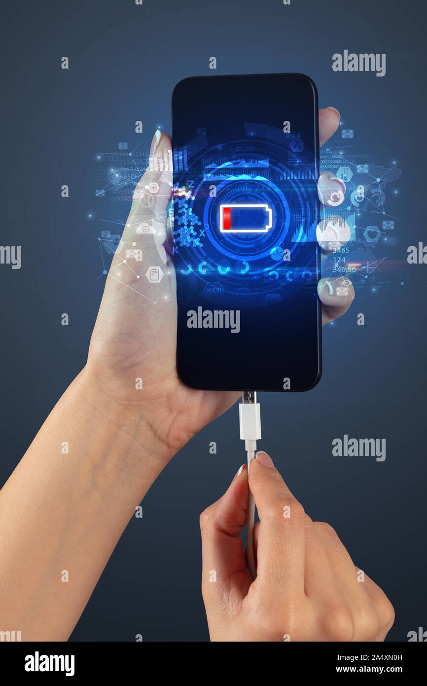 Elegant hand charging smartphone with global report concept Stock Photo ...