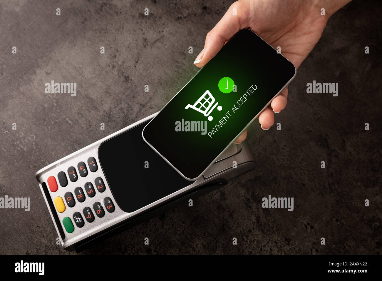 Mobile payment accepted on terminal Stock Photo - Alamy