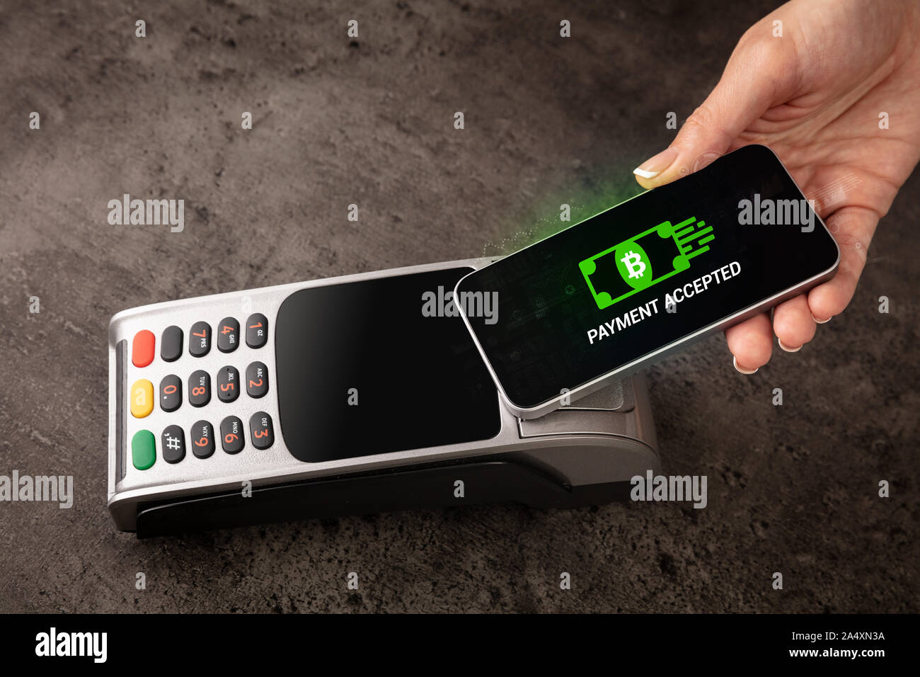 Hand paying with digital currency from smartphone Stock Photo - Alamy