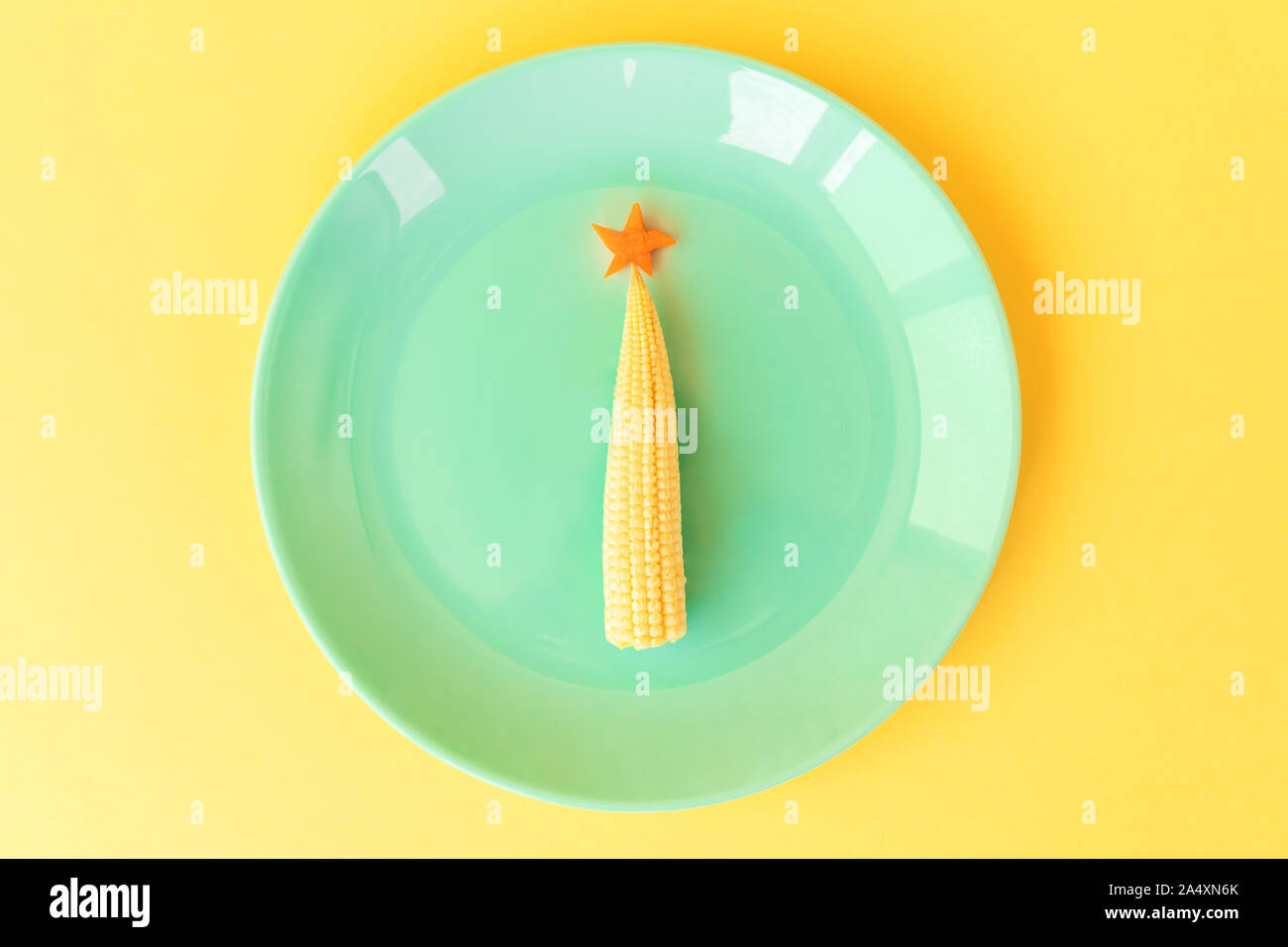 Funny edible Christmas tree from baby corn and carrot Stock Photo - Alamy