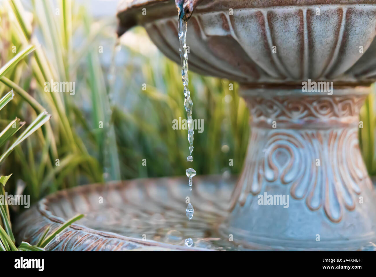 Running water from peaceful fountain Stock Photo - Alamy