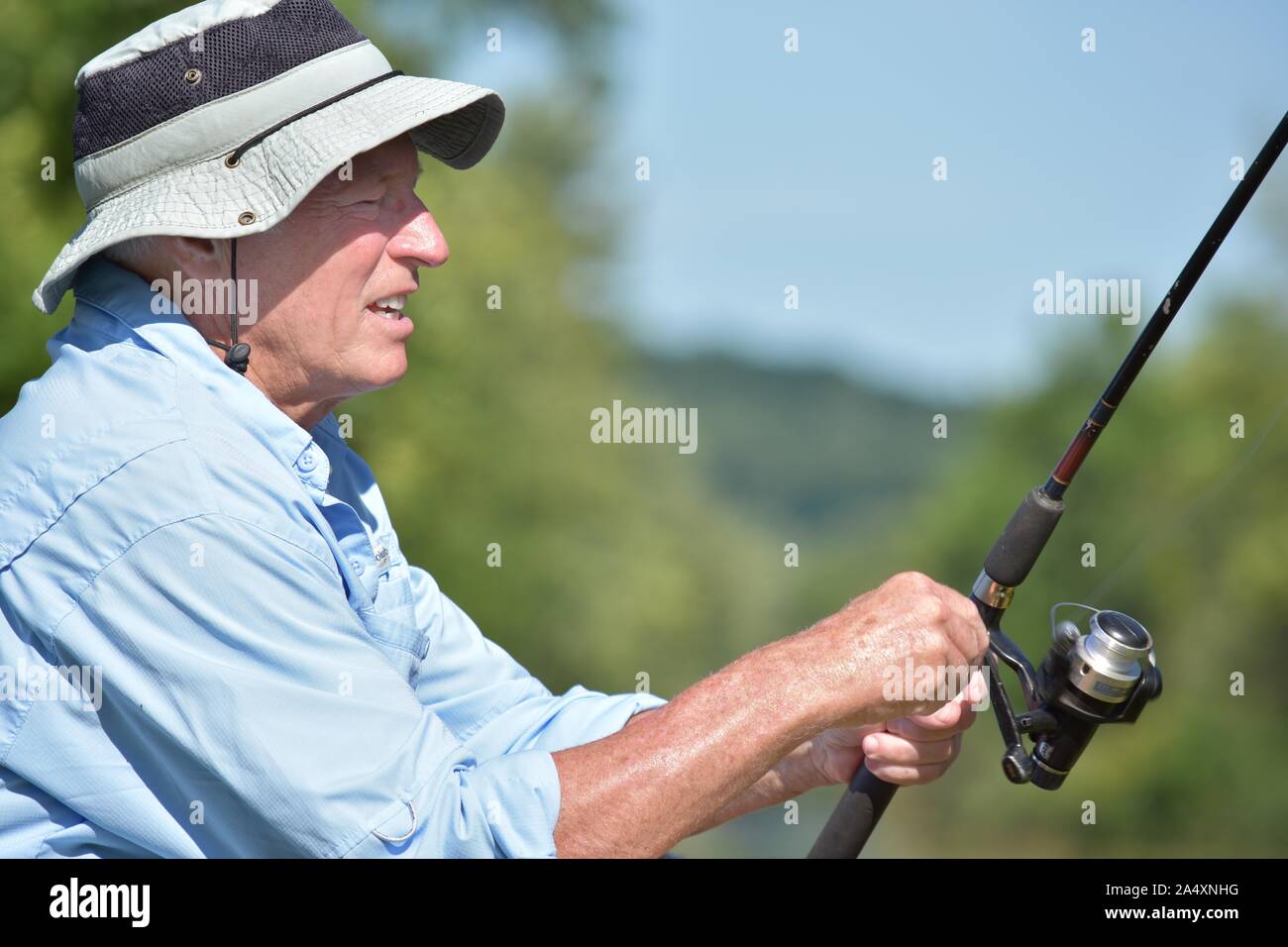 Old Senior Male Fisherman Resting With Rod And Reel Fishing Stock Photo ...