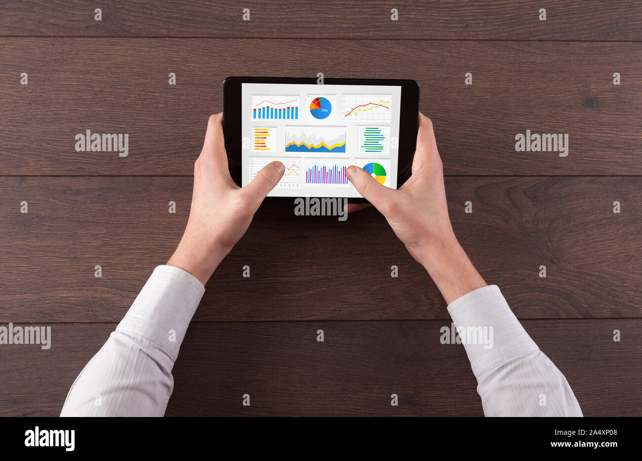Hand making diagrams and charts on tablet Stock Photo - Alamy