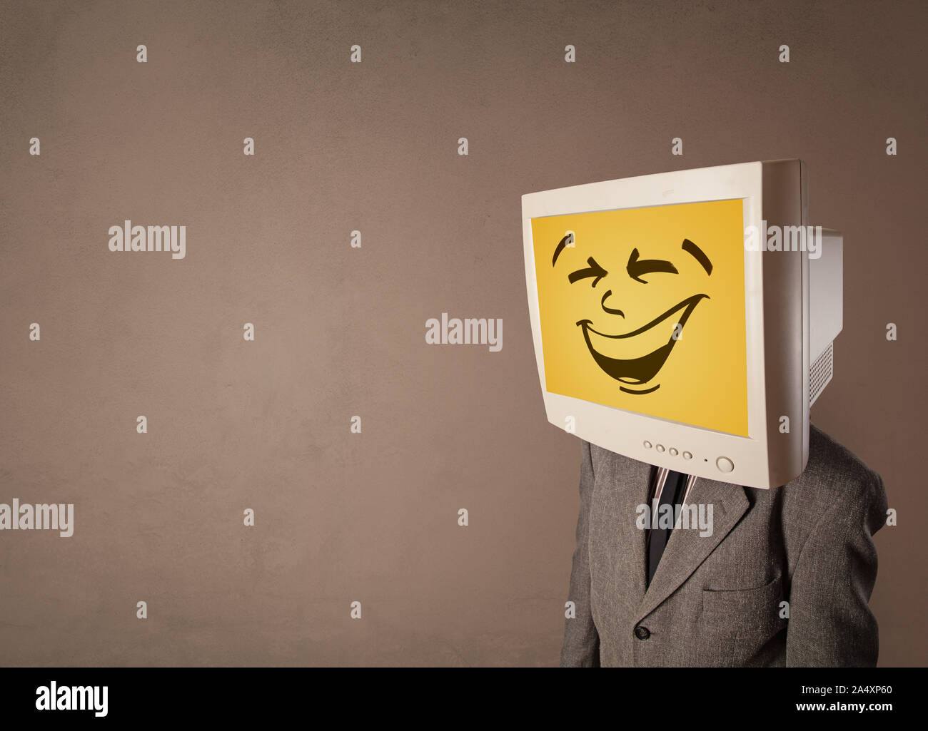 Young person with happy smiley monitor head Stock Photo - Alamy