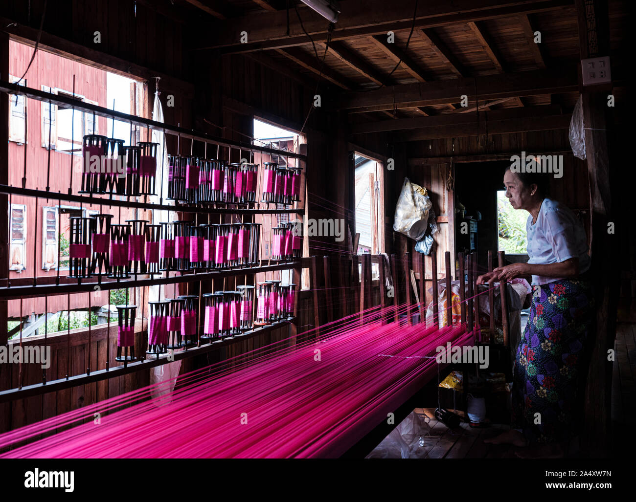 INLE LAKE, MYANMAR - CIRCA DECEMBER 2017: Burmese woman working a the ...