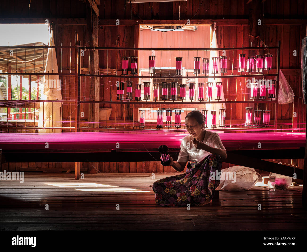 INLE LAKE, MYANMAR - CIRCA DECEMBER 2017: Burmese woman working a the ...