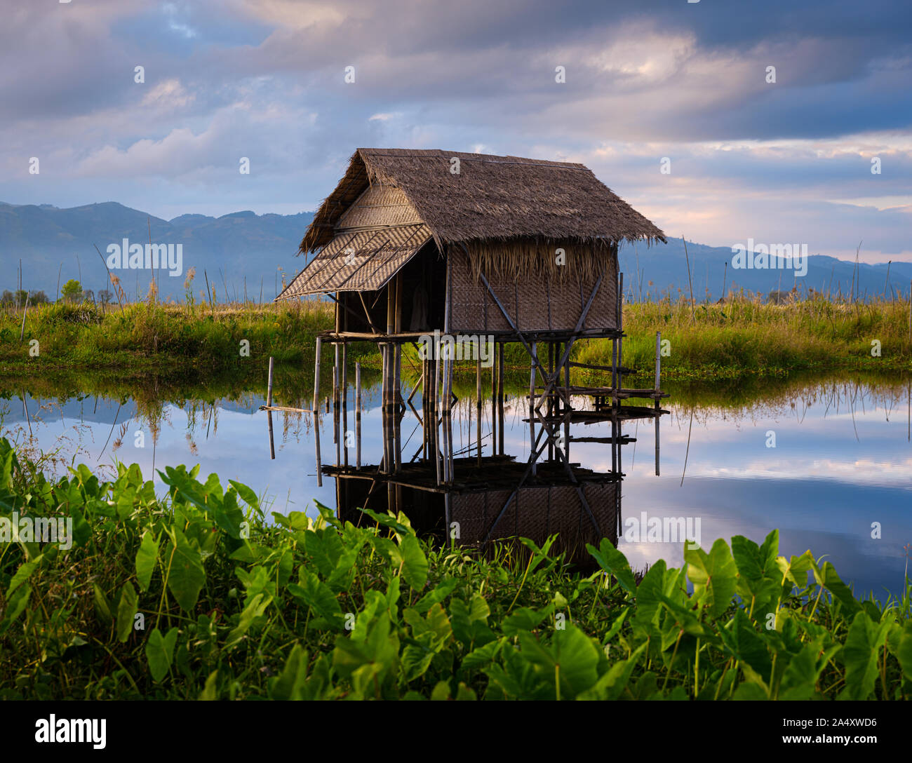 INLE LAKE, MYANMAR - CIRCA DECEMBER 2017: Typical hut built on stilts ...