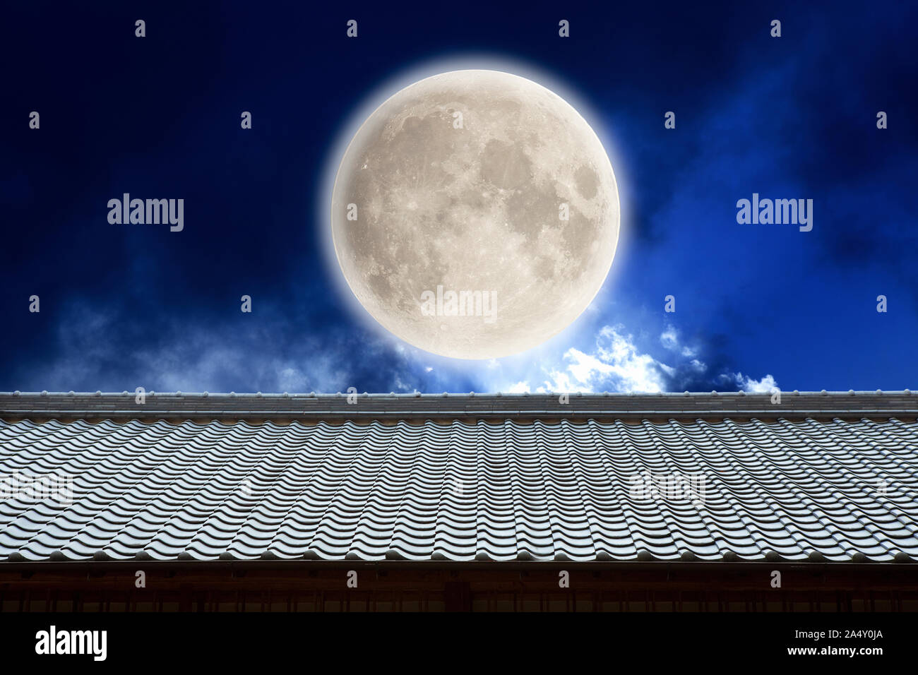 Full moon and tiled roof Stock Photo - Alamy