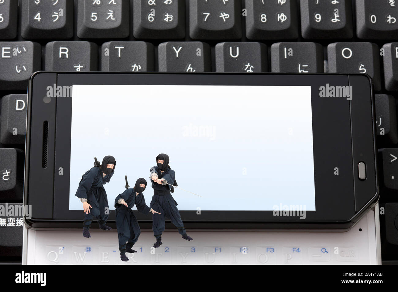 Ninja and mobile phone screen Stock Photo - Alamy