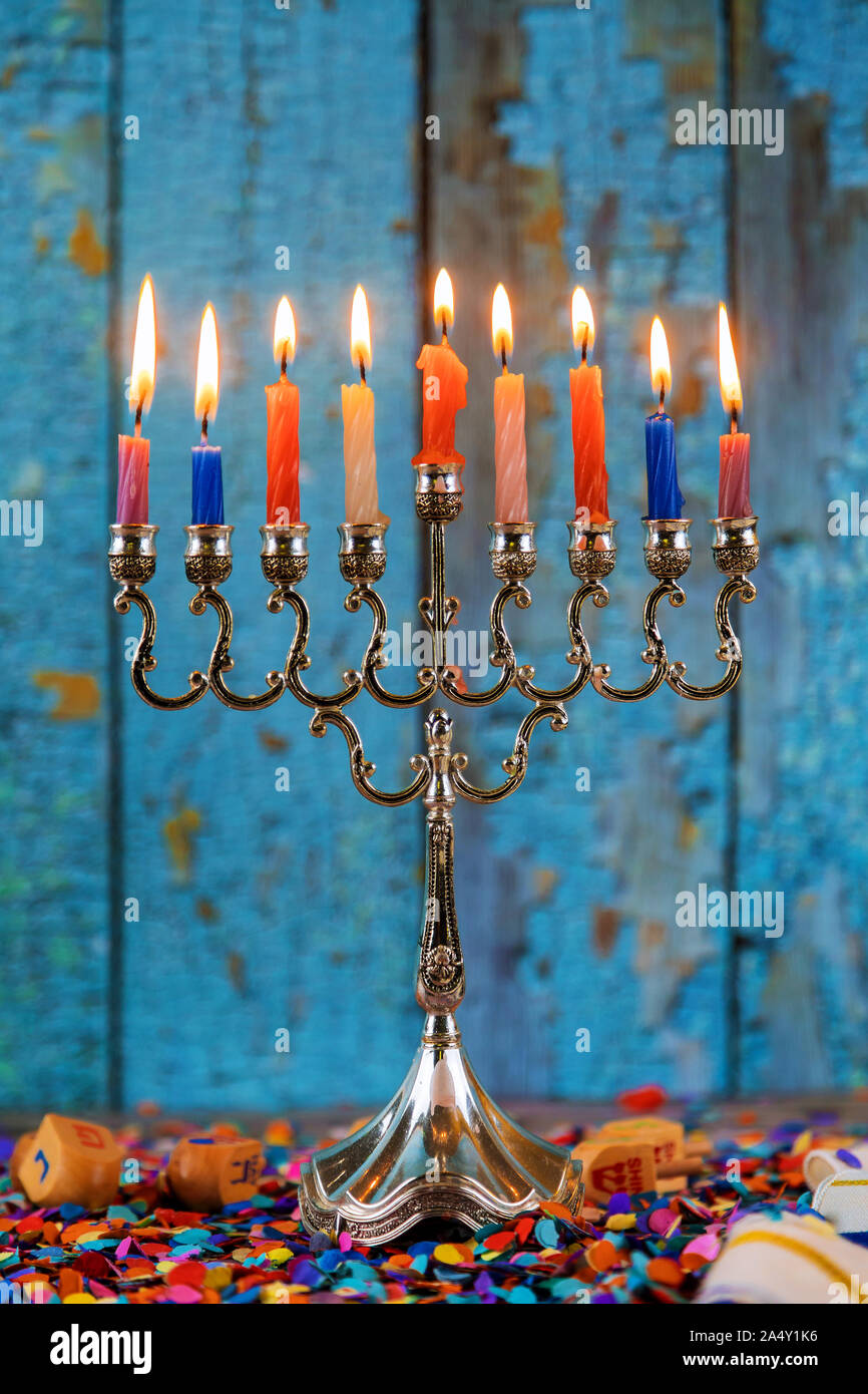 Silver traditional Hanukkah candles all candle lite in the menorah ...