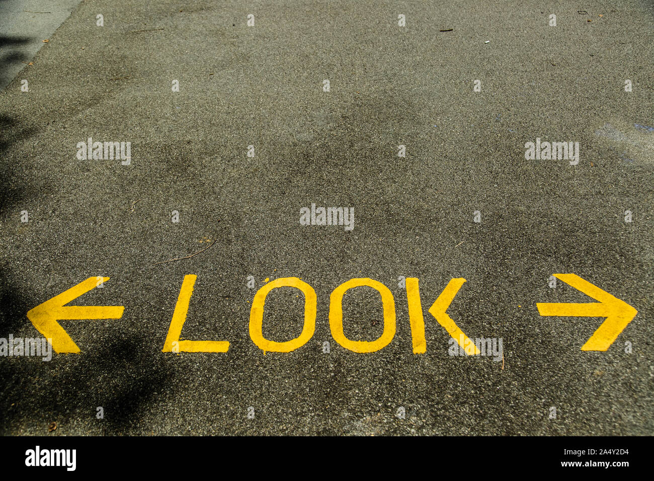 look right and left road safety sign on ground Stock Photo - Alamy