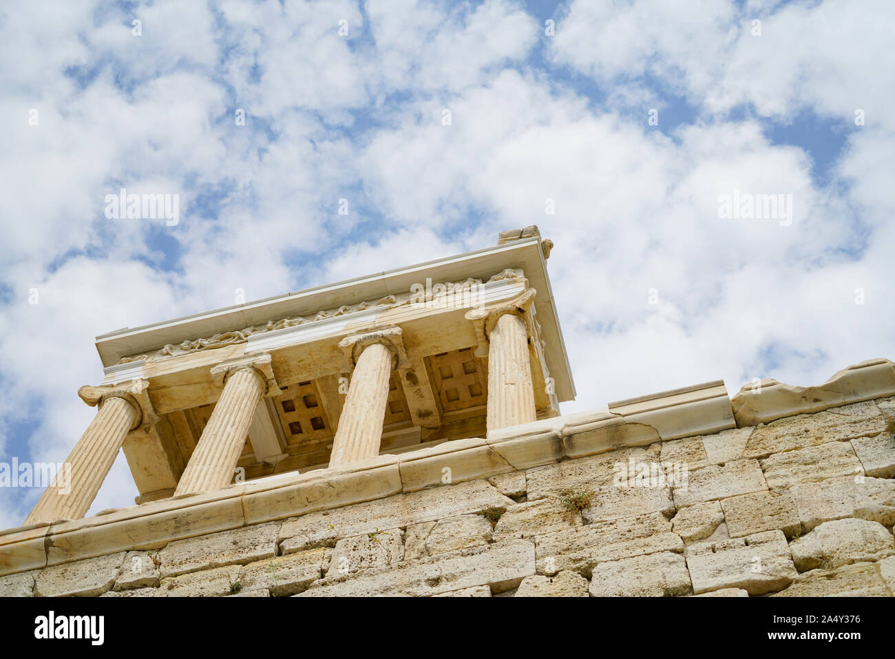 Ancient Structure supported by four pillars atop stone wall form low ...