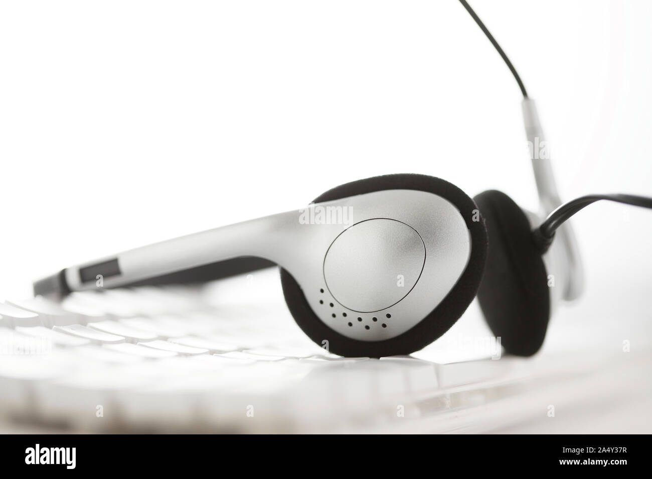 Office desk with headset and PC Stock Photo - Alamy
