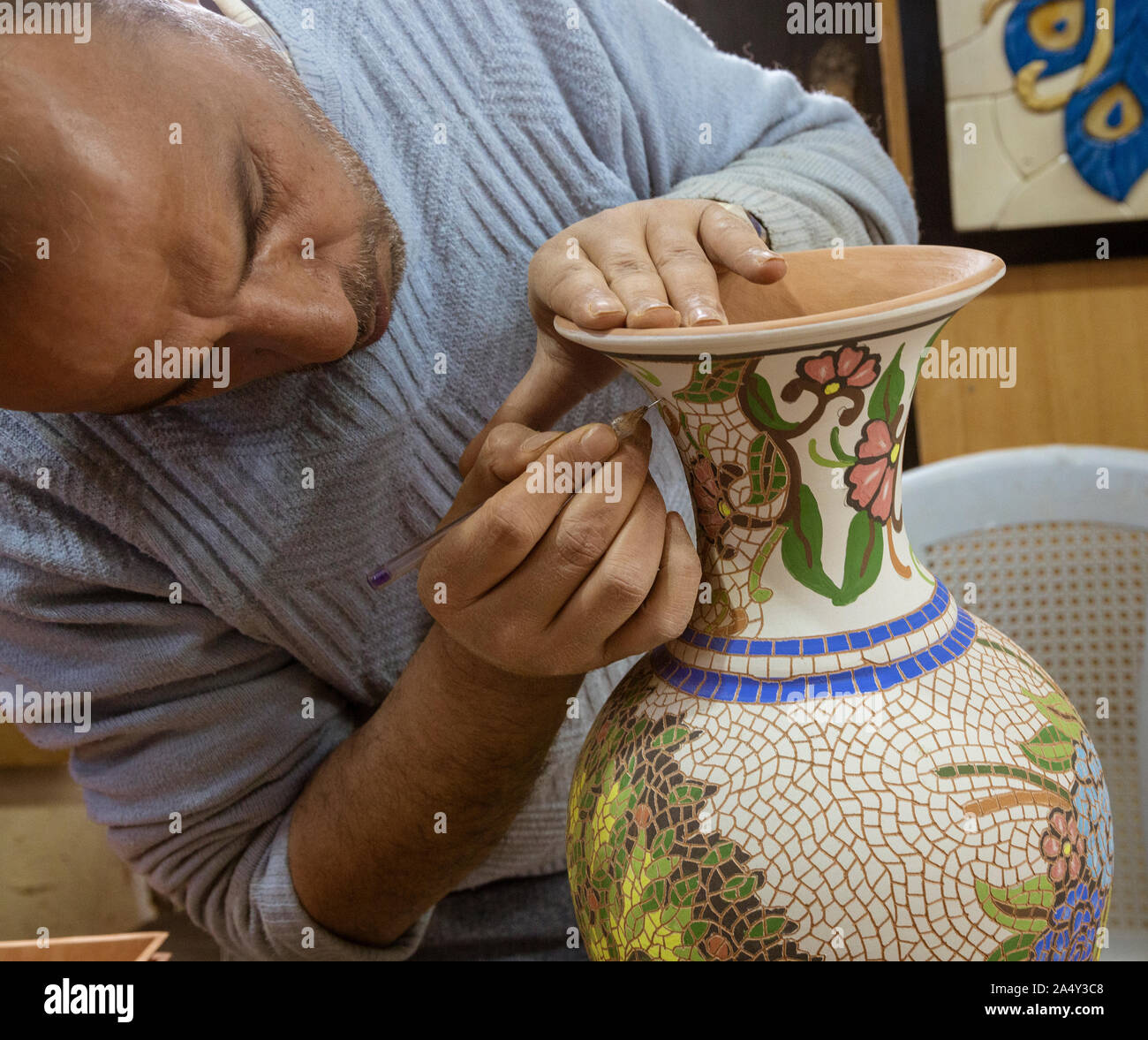 Petra, Jordan - 2019-04-20 - Man creates intricate mosaic vase Stock ...