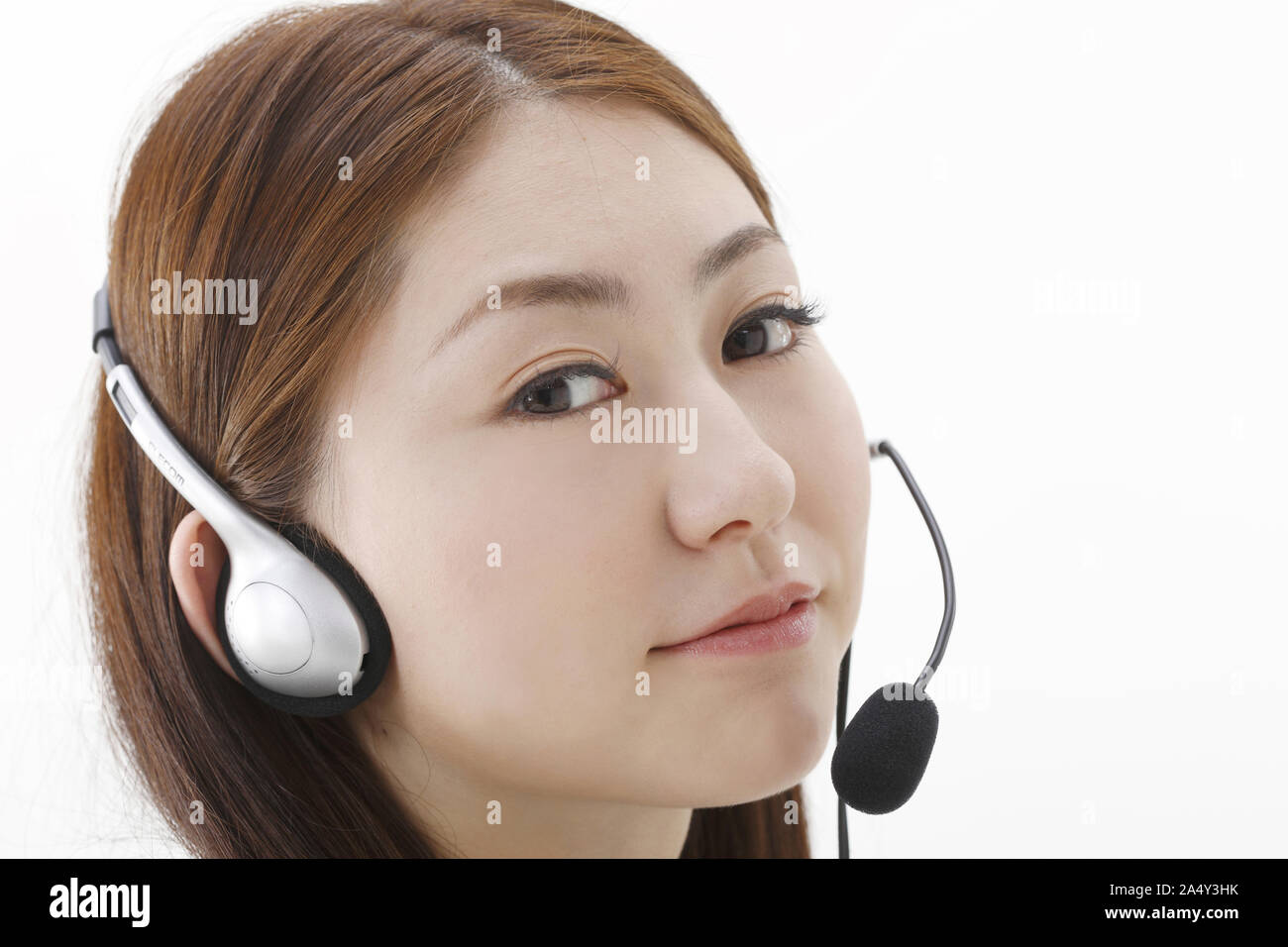 A telephone operator talking into a mic Stock Photo - Alamy