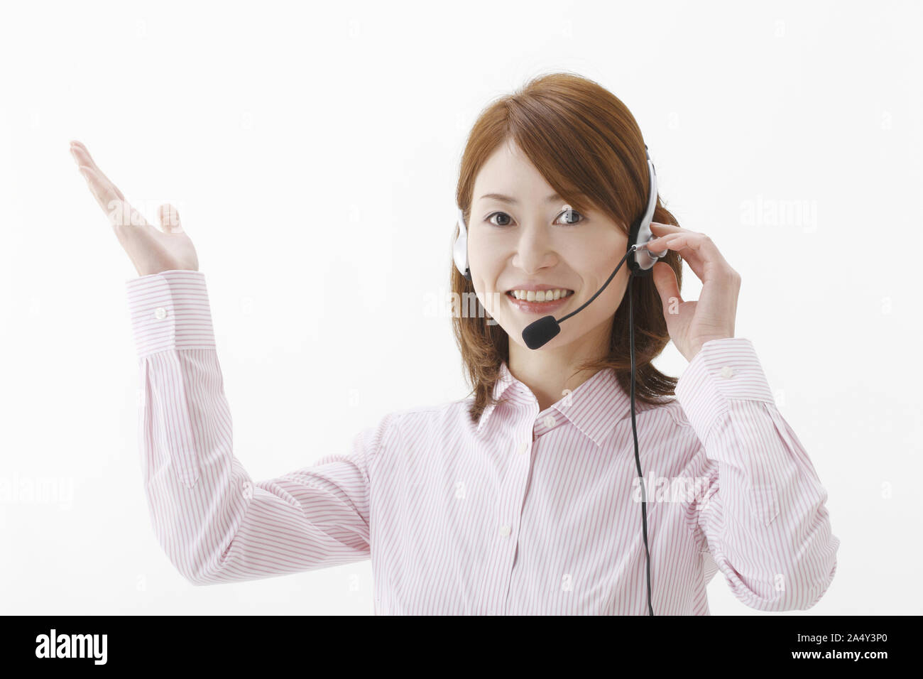 A telephone operator talking into a mic Stock Photo - Alamy