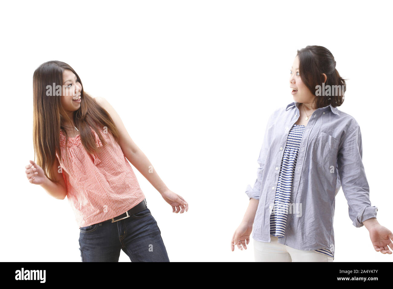 Two women exchange a surprised look Stock Photo - Alamy