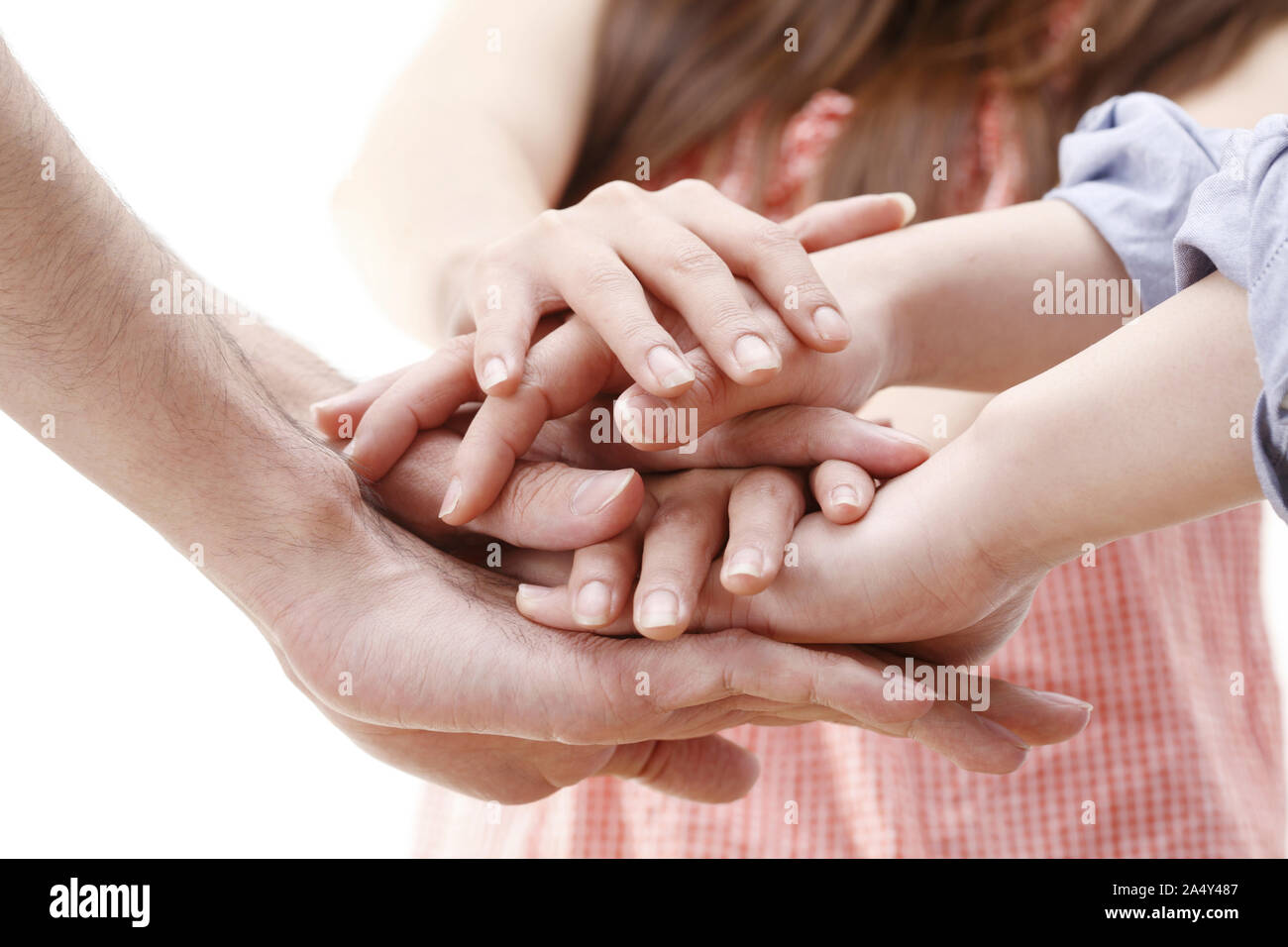 Group of people putting hands together Stock Photo - Alamy