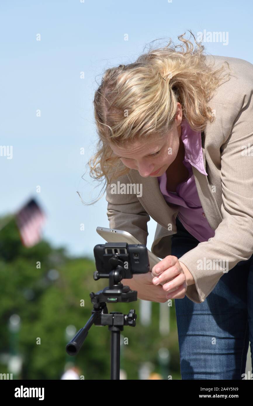 Woman Operating Electronic Devices Stock Photo - Alamy