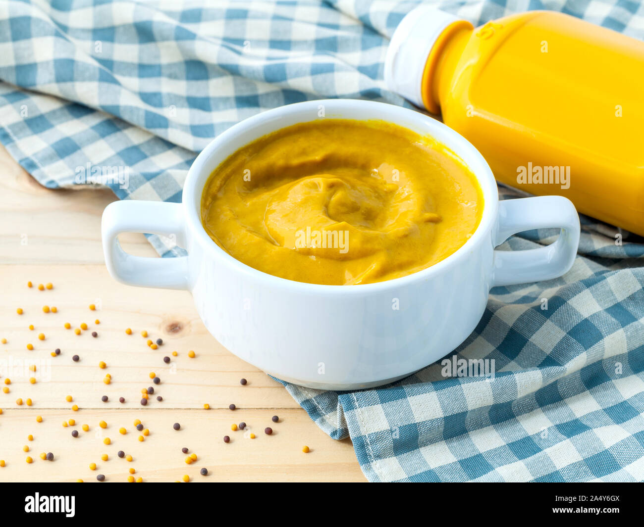 Composition of mustard and mustard seeds on wooden background Stock ...