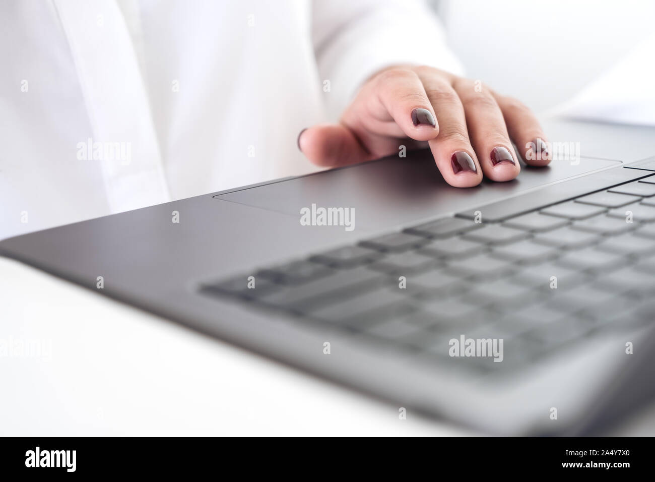 Closeup image of woman's hands using and touching on laptop keyboard ...