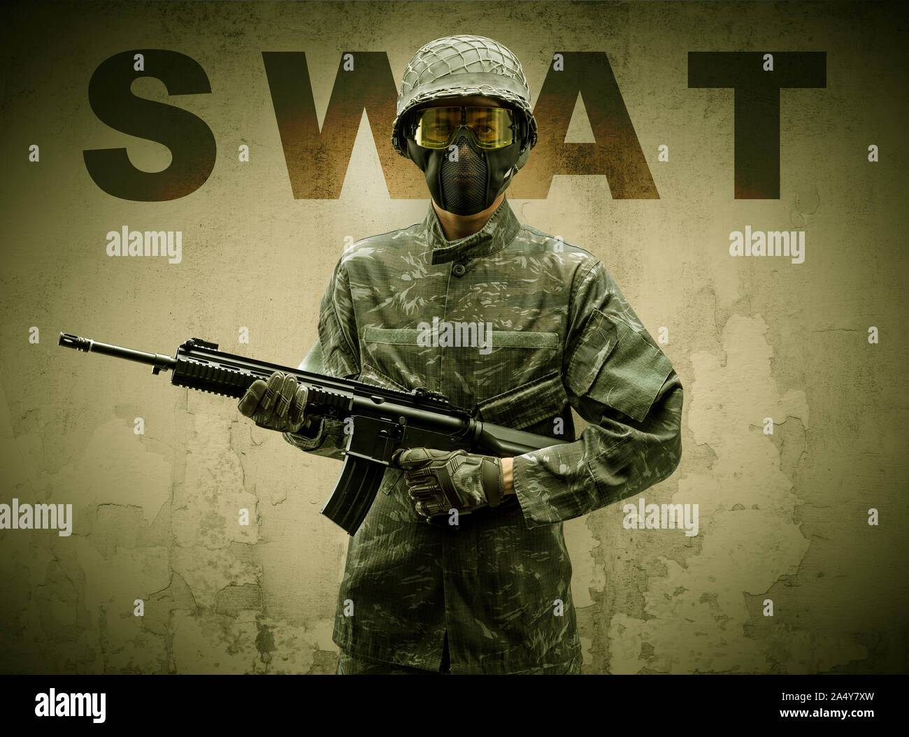 Uniformed armed soldier with damaged wall background Stock Photo - Alamy