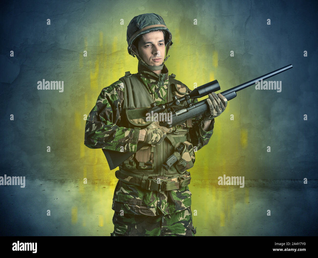 Hazard, menace soldier in a ruined crumbly building with arms on his ...