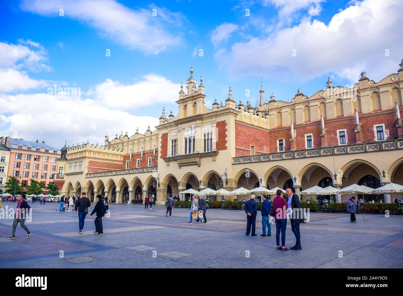 Tourists enjoying their time at Krakow Cloth Hall, the central feature ...