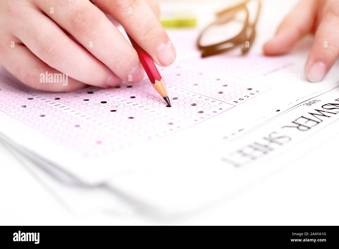 Picture of a man filling the OMR sheet Stock Photo - Alamy