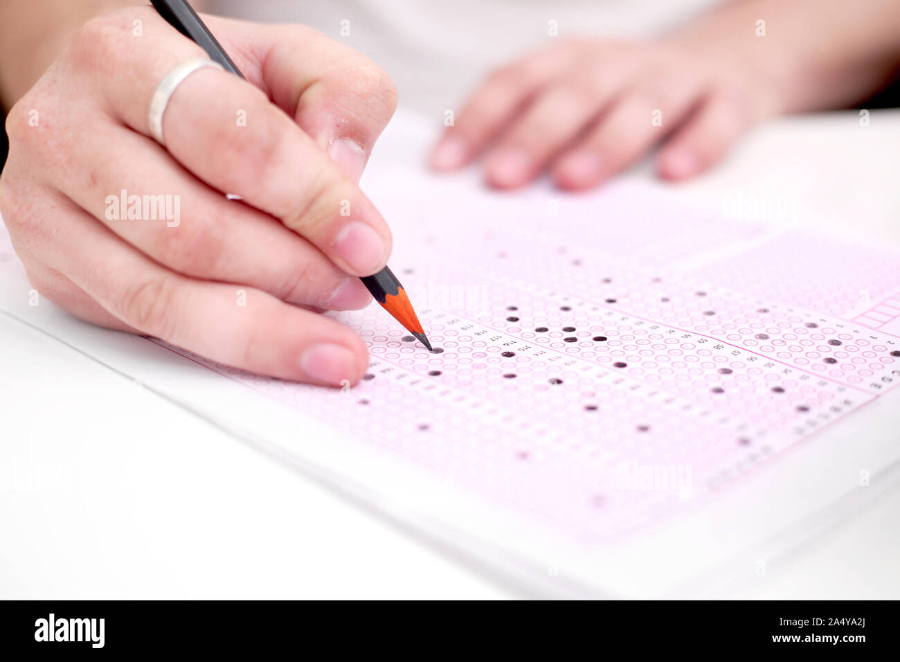 Picture of a man filling the OMR sheet Stock Photo - Alamy